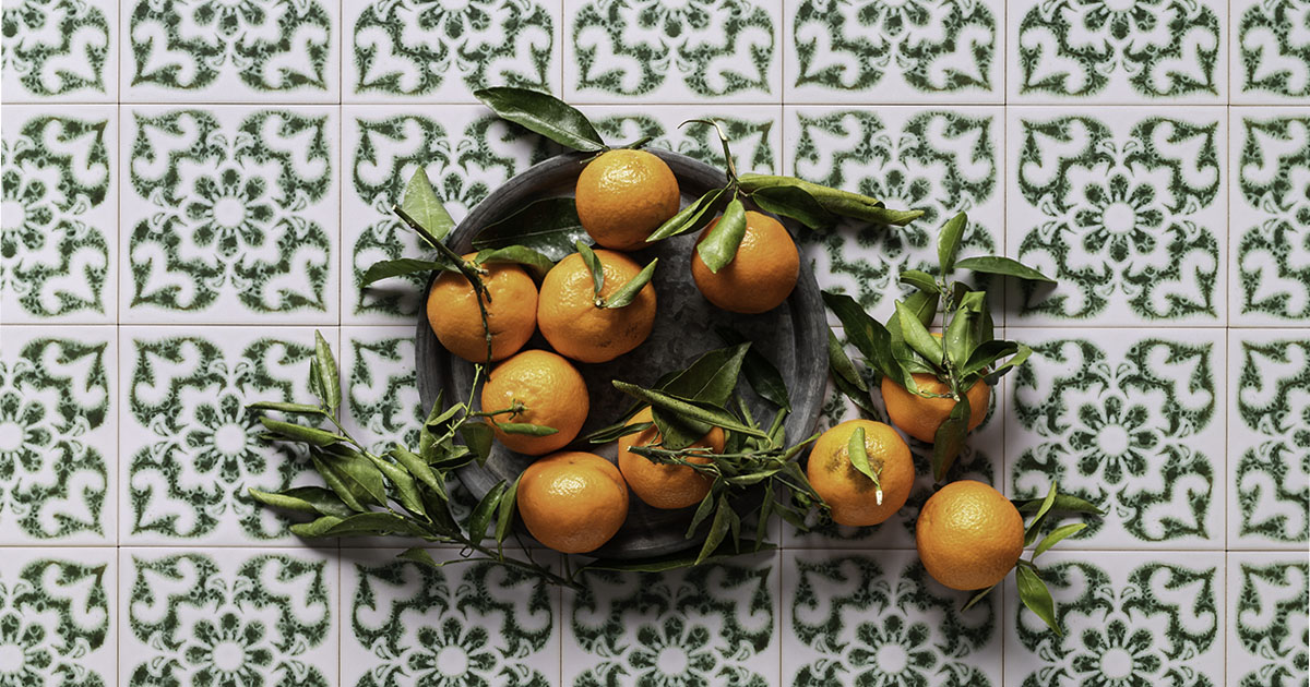 Vinyl background with white tiles and a dark green flower pattern