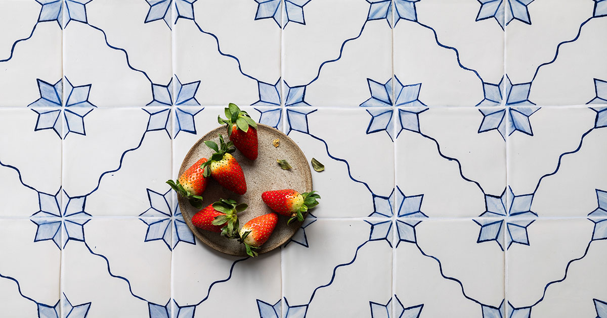 Tiled photography background in blue and white printed on vinyl